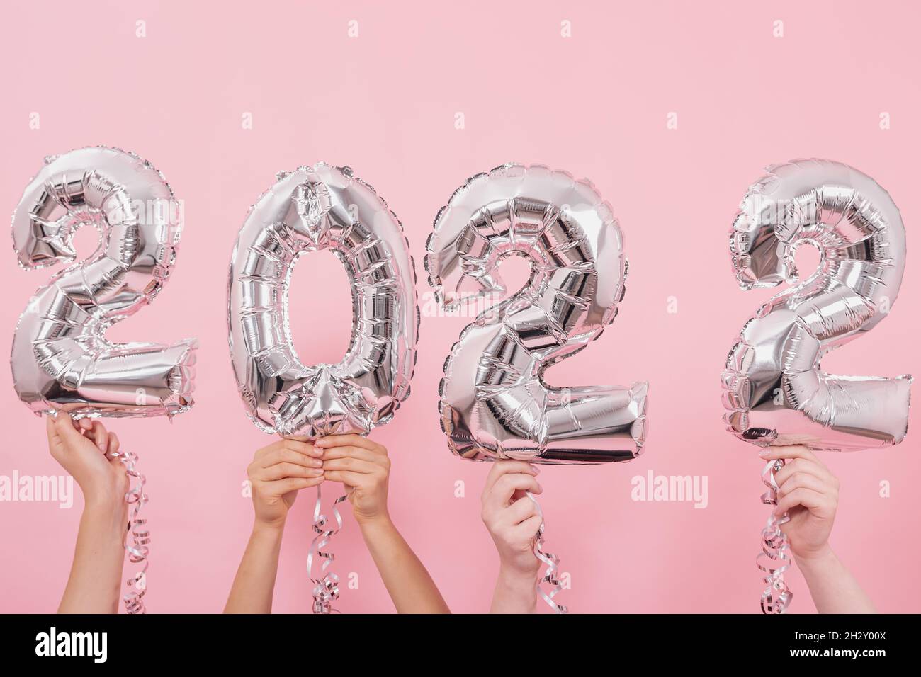 Festive balloons in from the numbers 2022 on a pink background Stock ...