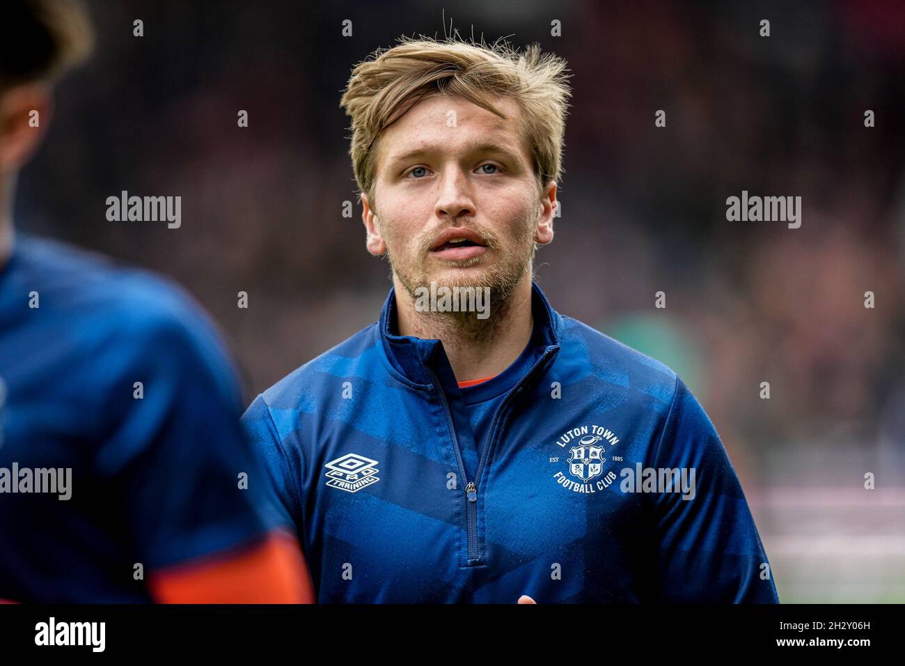 Luton, UK. 25th June, 2021. Luke Berry (8) of Luton Town warms up ahead ...
