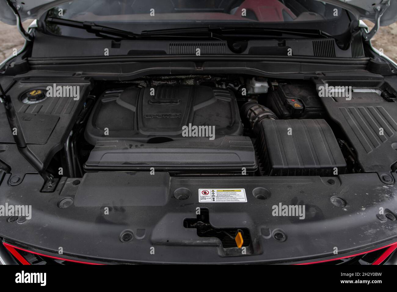 SUV car with open hood. Car engine. Car engine and parts under hood ...