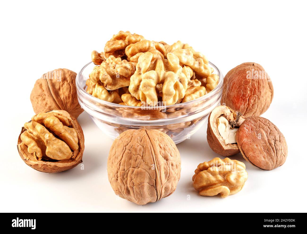 fresh kernels, broken and whole walnuts close-up isolated on white ...