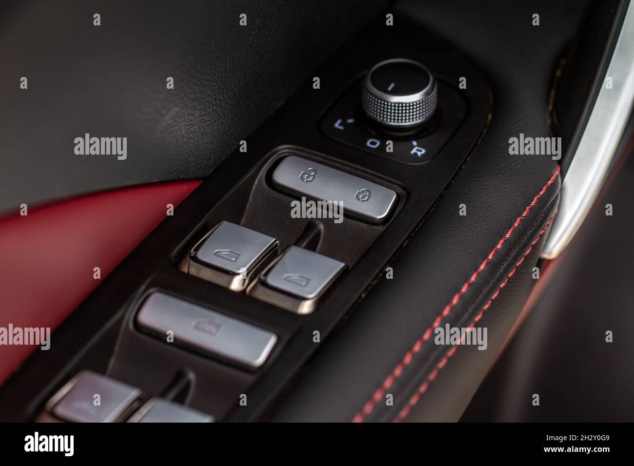 Close up view of button controlling window in modern car interior ...