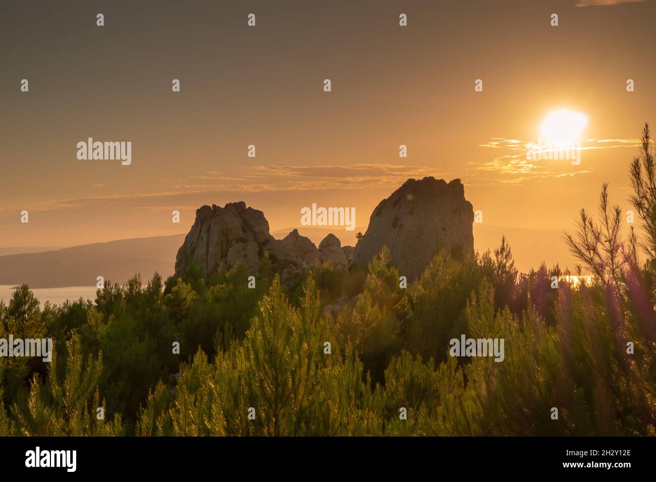 Two big rocks on the mountain in sunset Stock Photo - Alamy