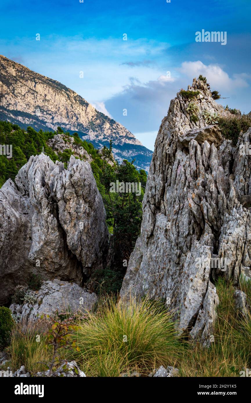 Way down from mountain in between two cliffs Stock Photo - Alamy
