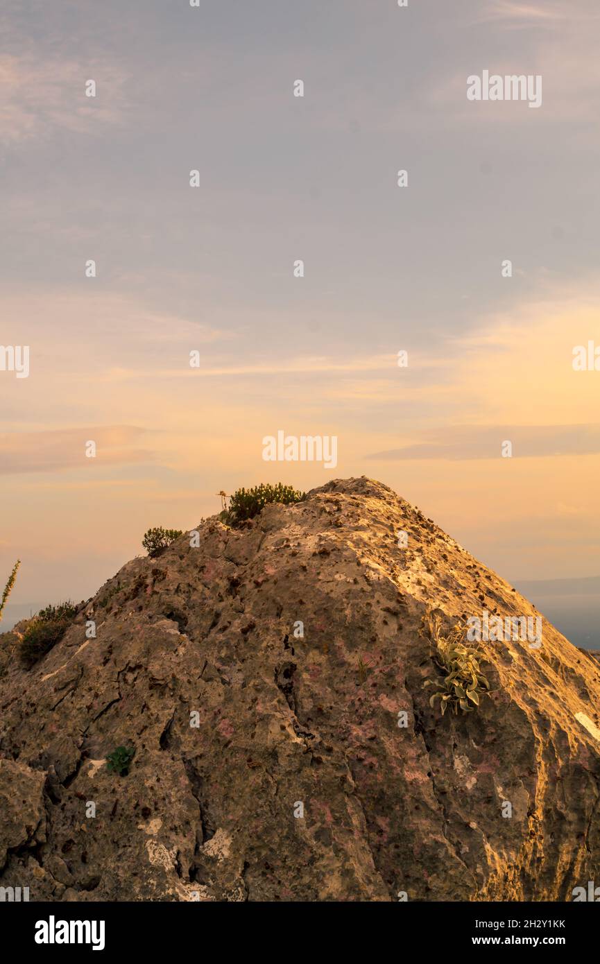 Top of cliff in sunset Stock Photo - Alamy