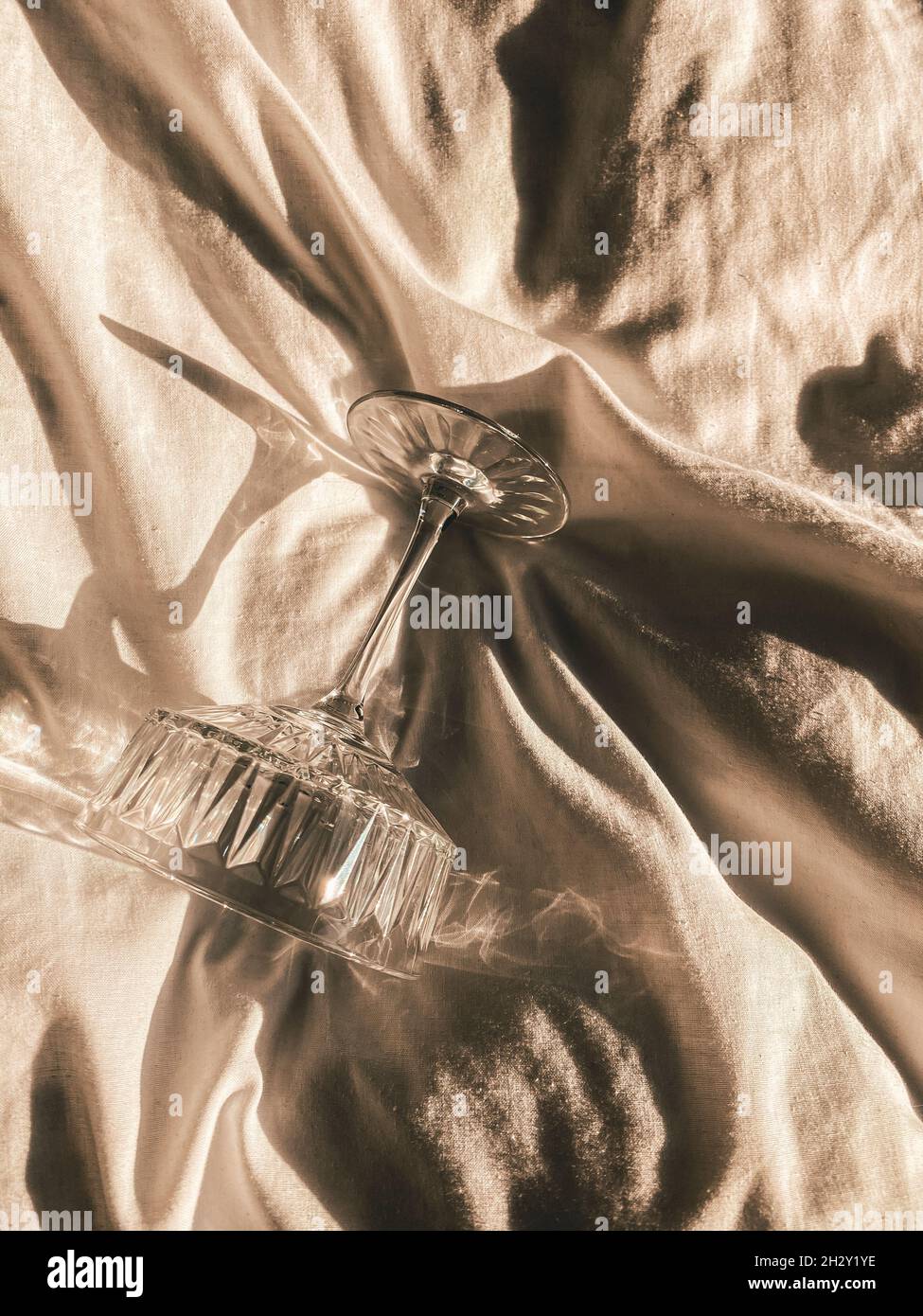 crystal glass that flashes on a white fabric background from the autumn ...