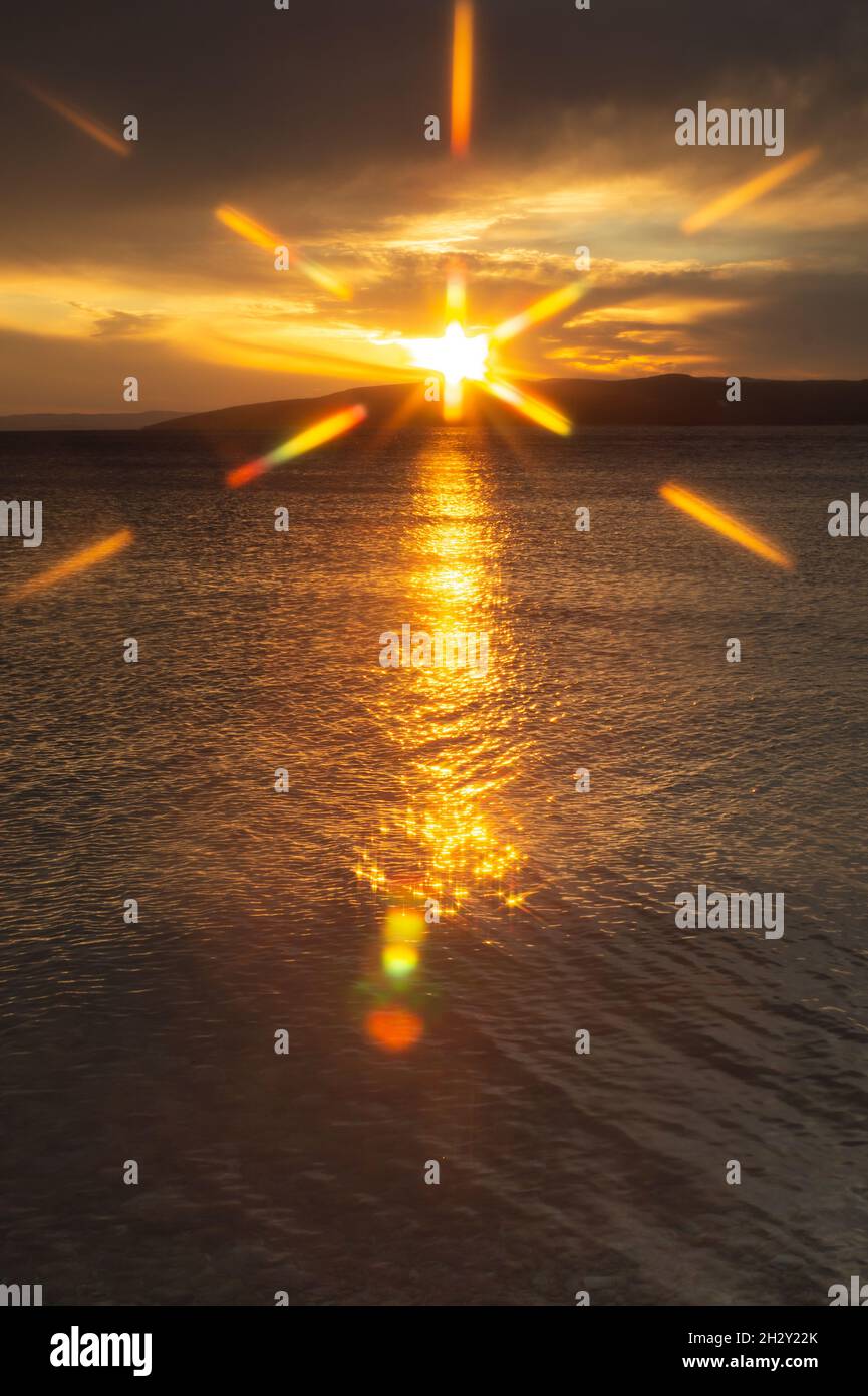 Lens flare in sunset Stock Photo - Alamy