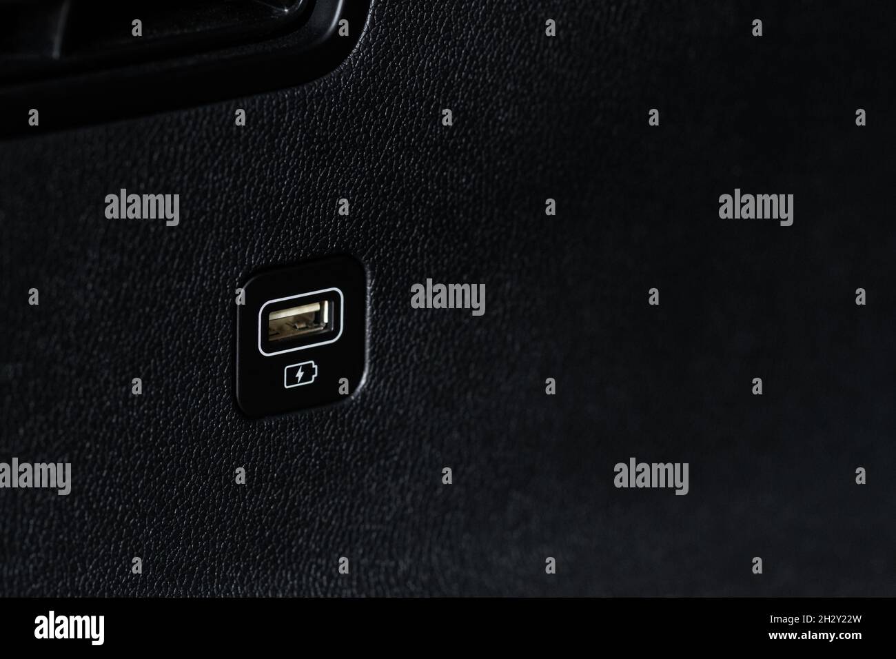 Opened car USB port in the car for connecting device. Power output of ...