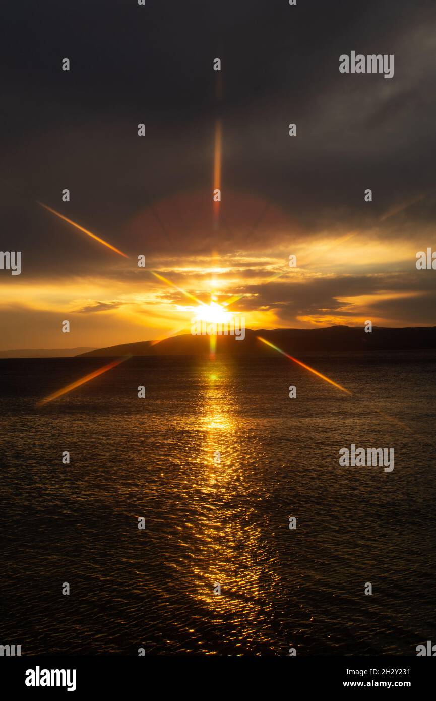 Lens flare in sunset Stock Photo - Alamy