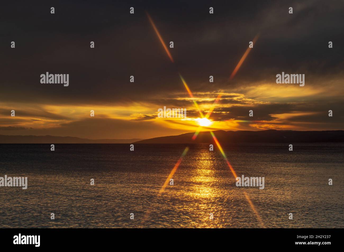 Lens flare in sunset Stock Photo - Alamy