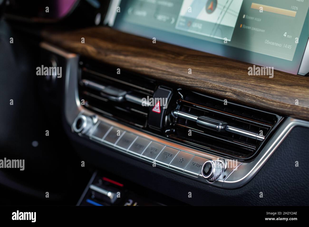 Red triangle hazard light button on car dashboard. Car media buttons ...