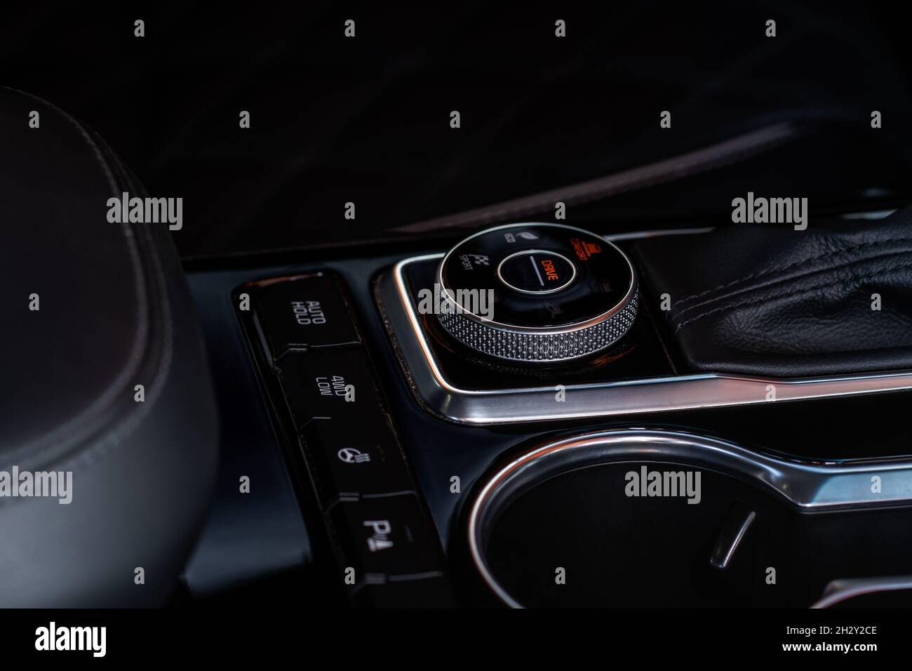 Drive selector button. Car interior, offroad drive controller closeup ...