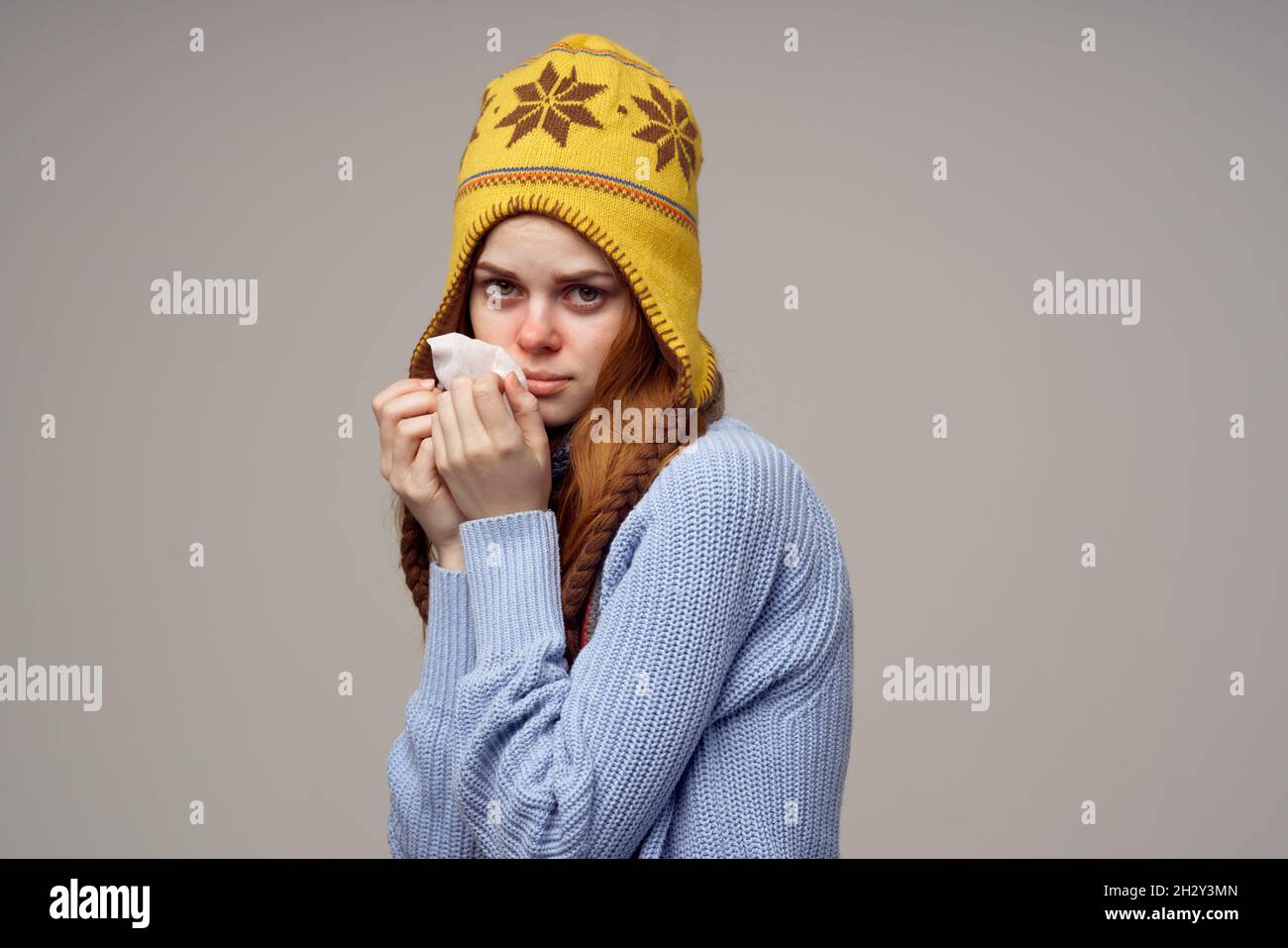 sick woman health problems temperature light background Stock Photo - Alamy