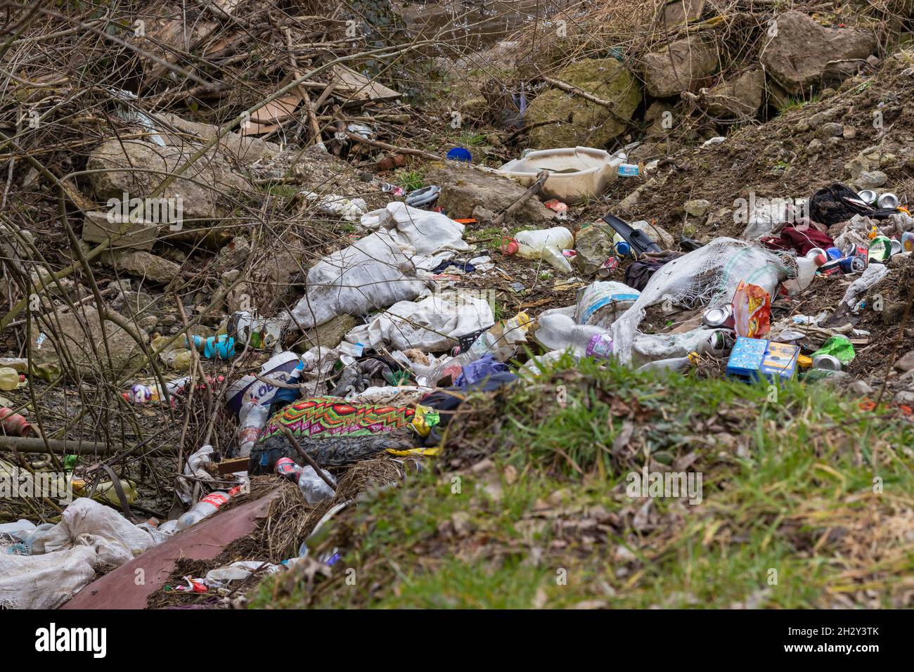 Garbage dumped on the field that pollutes the soil and air Stock Photo ...