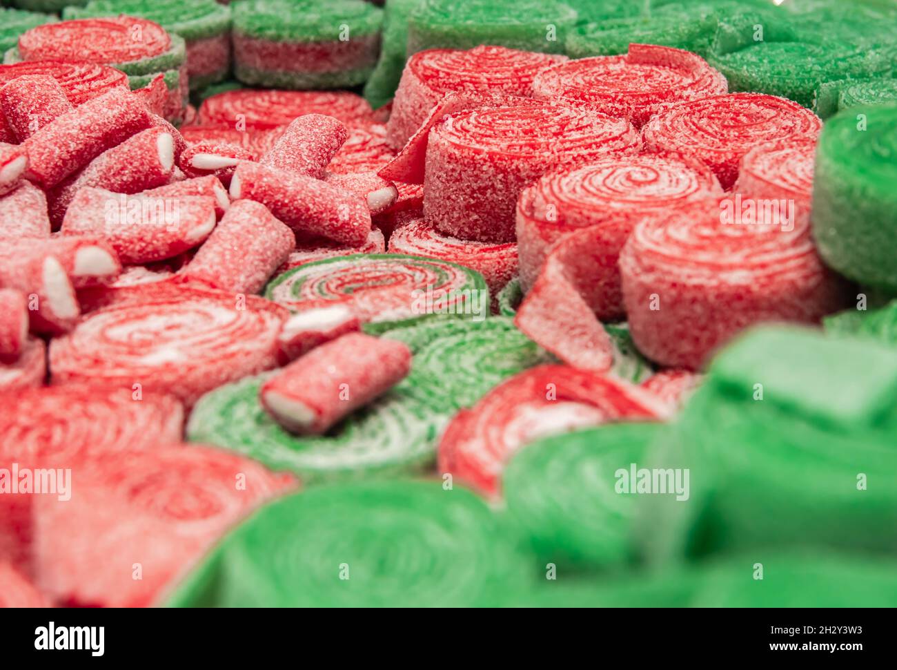 Set of red and green rolled chewing candies, close up Stock Photo - Alamy