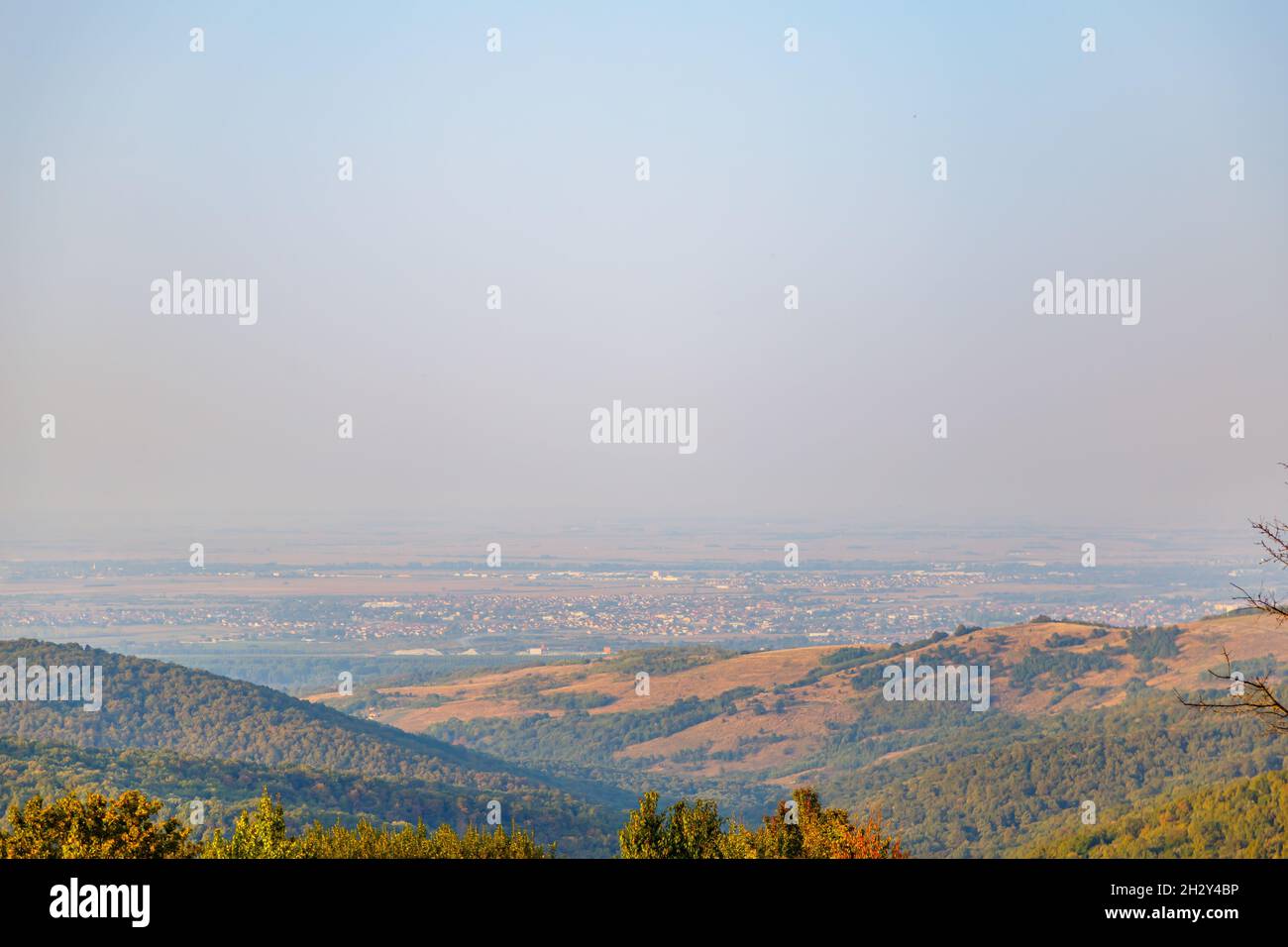 An aerial view of Novi Sad mountains with autumn trees in Fruska Gora ...