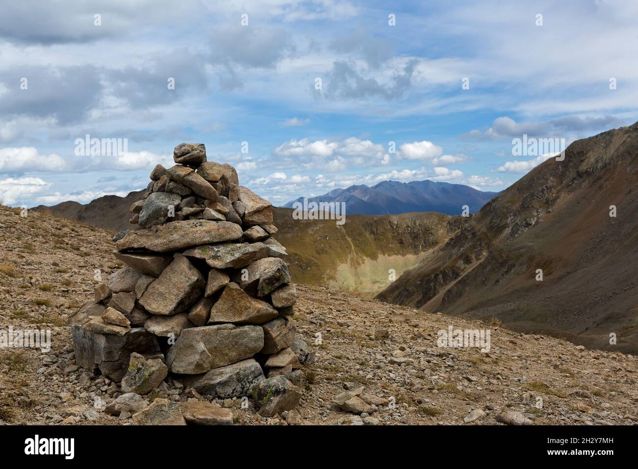 Large pyramid of stones on the edge of the cliff Stock Photo - Alamy
