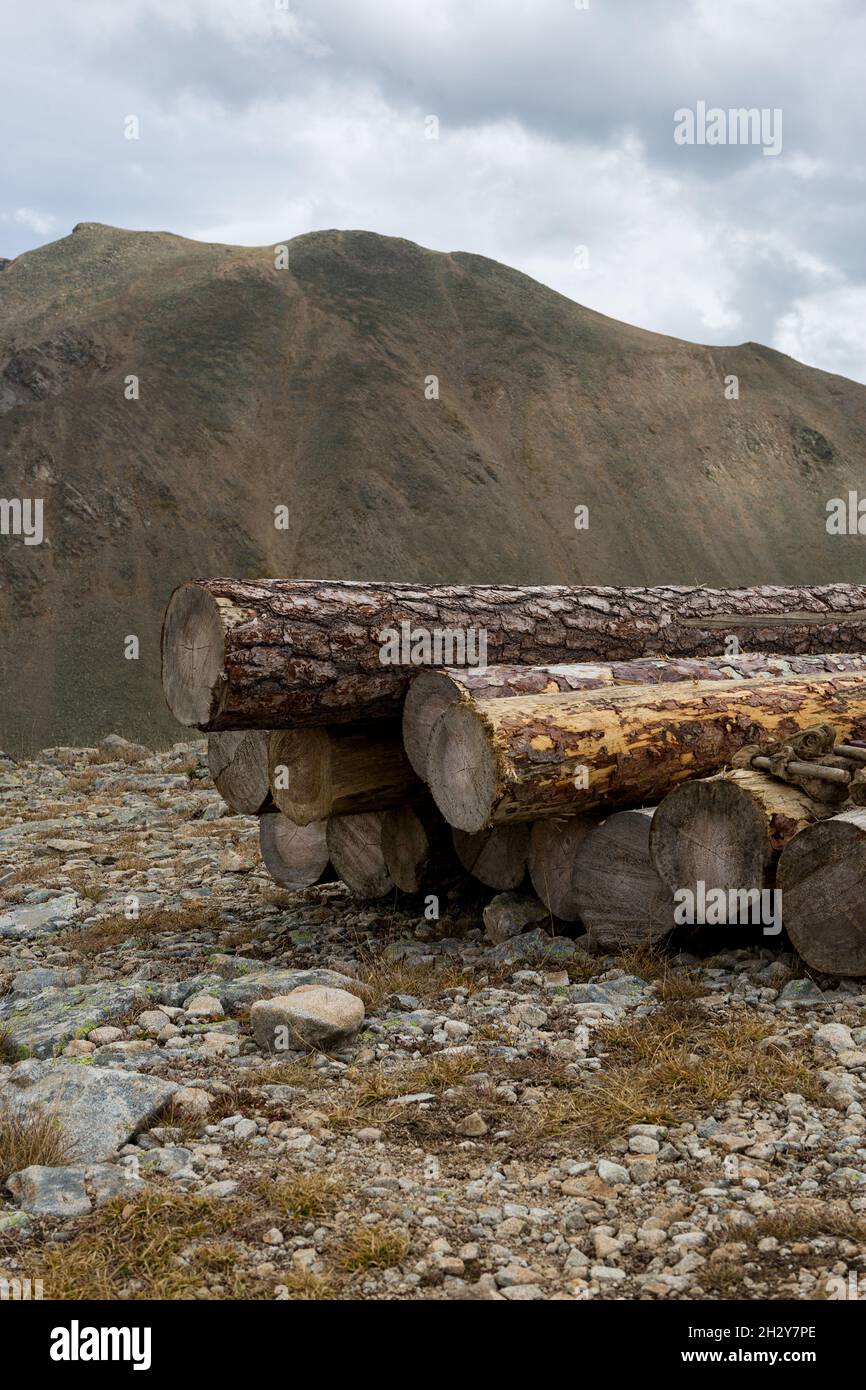 Pile of sawn logs on top of a mountainous area Stock Photo - Alamy