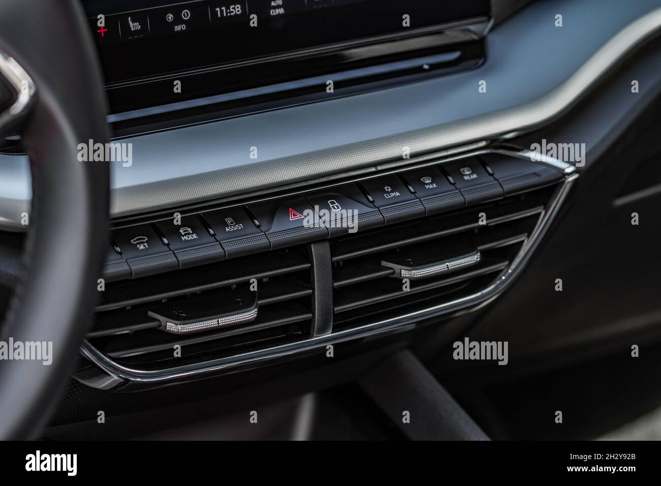 Red triangle hazard light button on car dashboard. Car media buttons ...