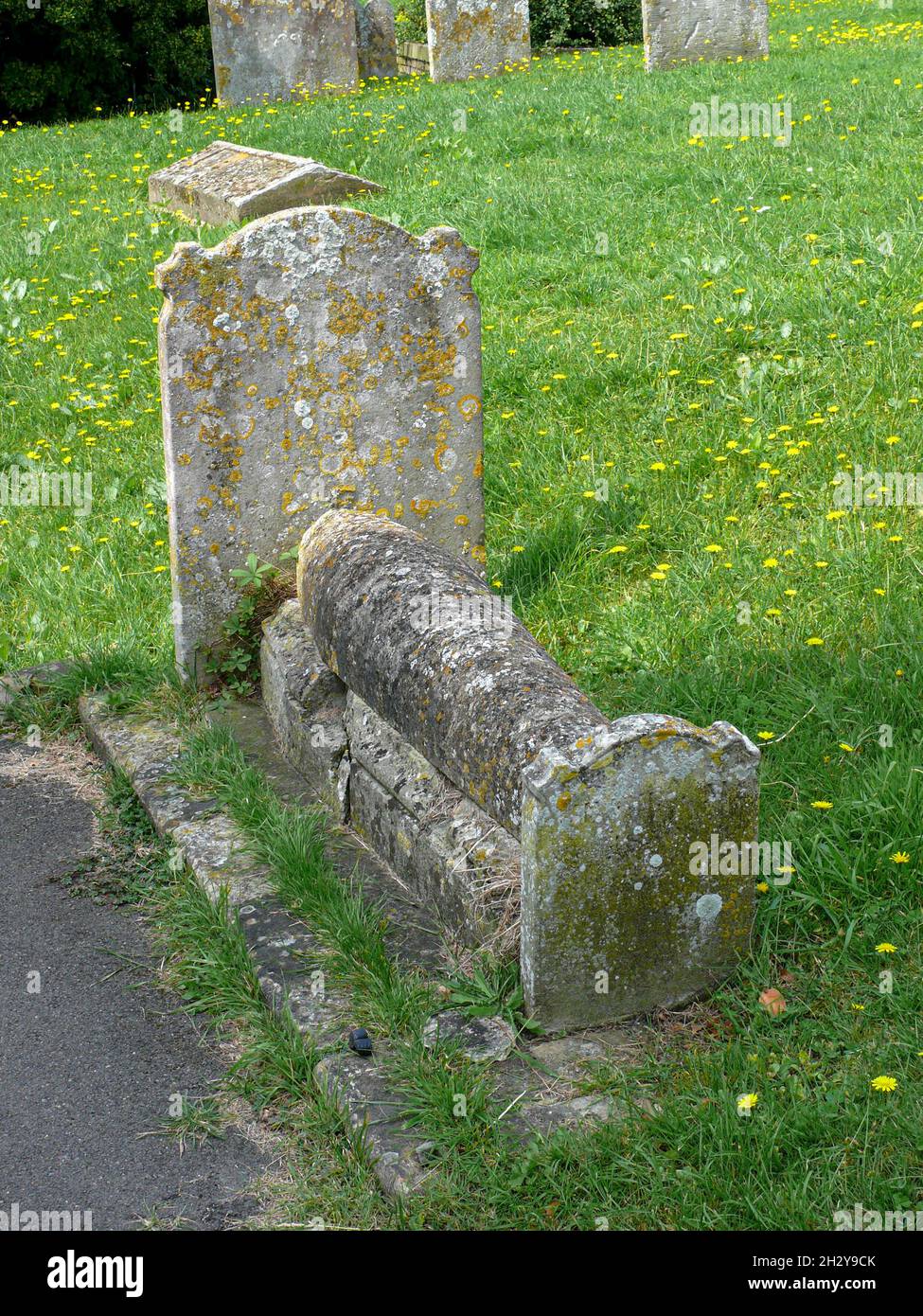 Grave with a curved body stone, Kent, England Stock Photo - Alamy