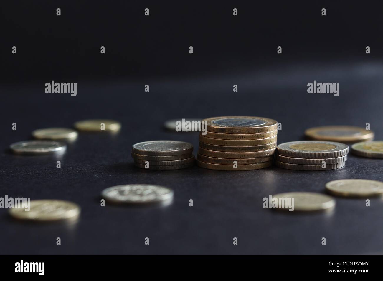 Coins stacked on each other in different positions. collect coins. A ...