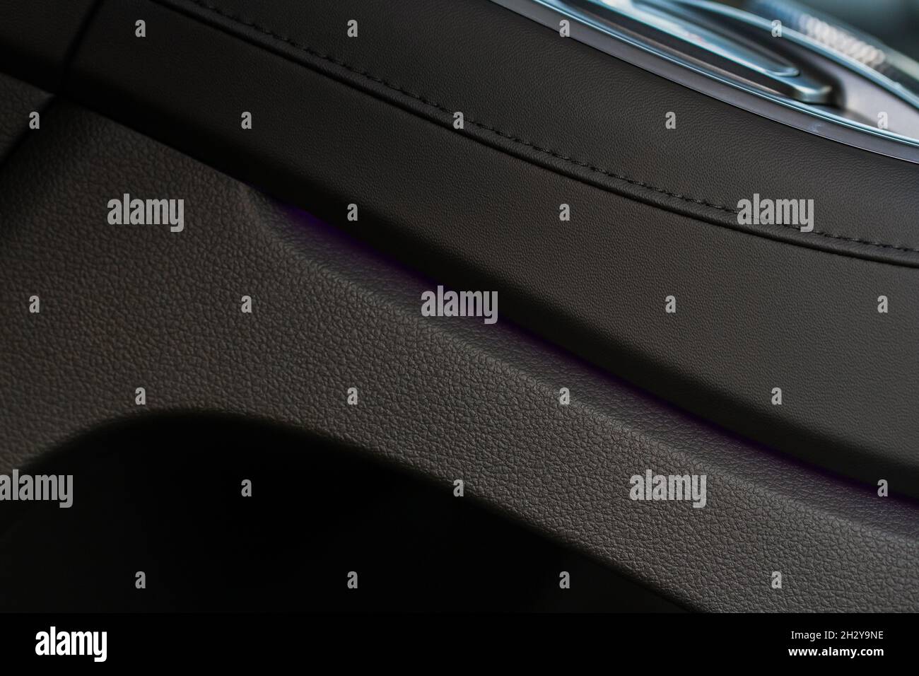 Modern car interior close up view with metallic and plastic details ...