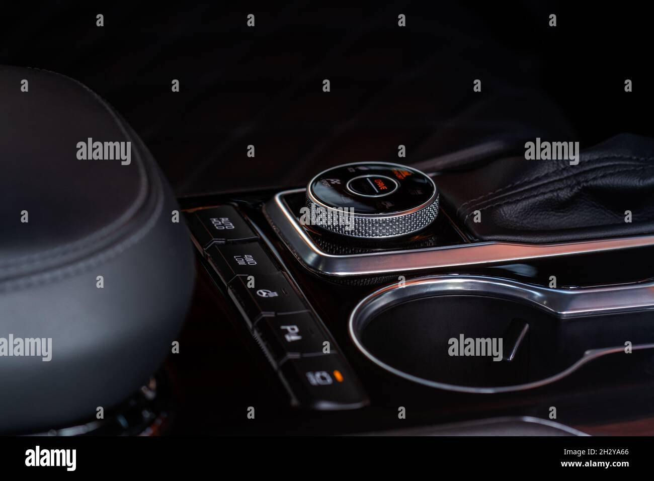 Drive selector button. Car interior, offroad drive controller closeup ...