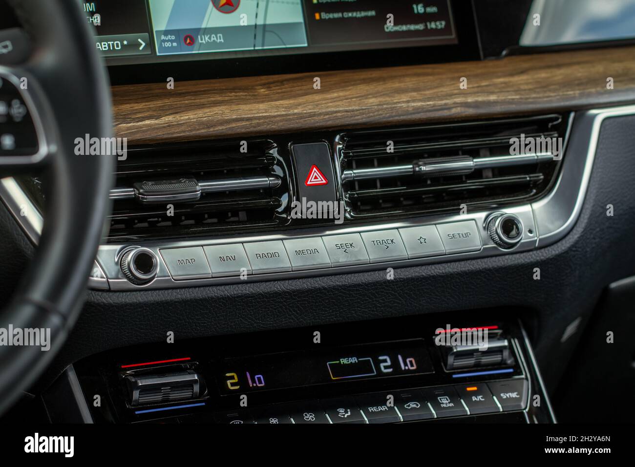 Red triangle hazard light button on car dashboard. Car media buttons ...