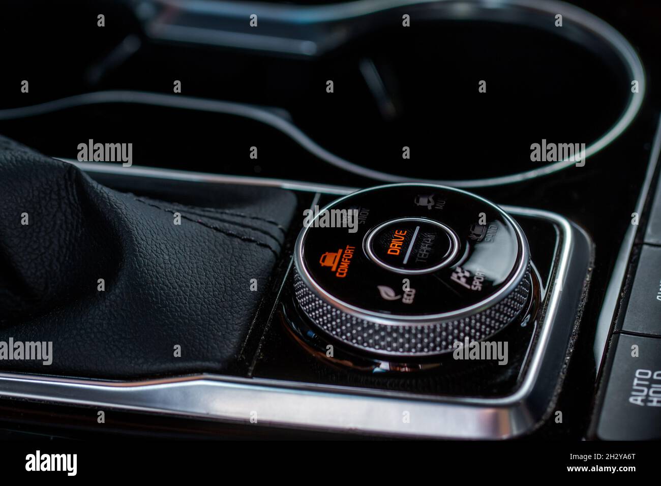 Drive selector button. Car interior, offroad drive controller closeup ...