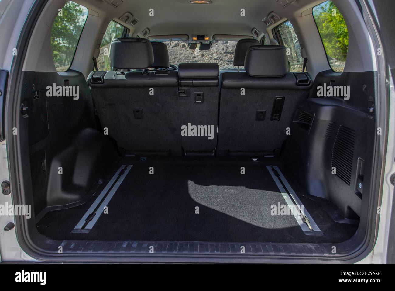Huge, clean and empty car trunk in interior of compact suv. Rear view ...