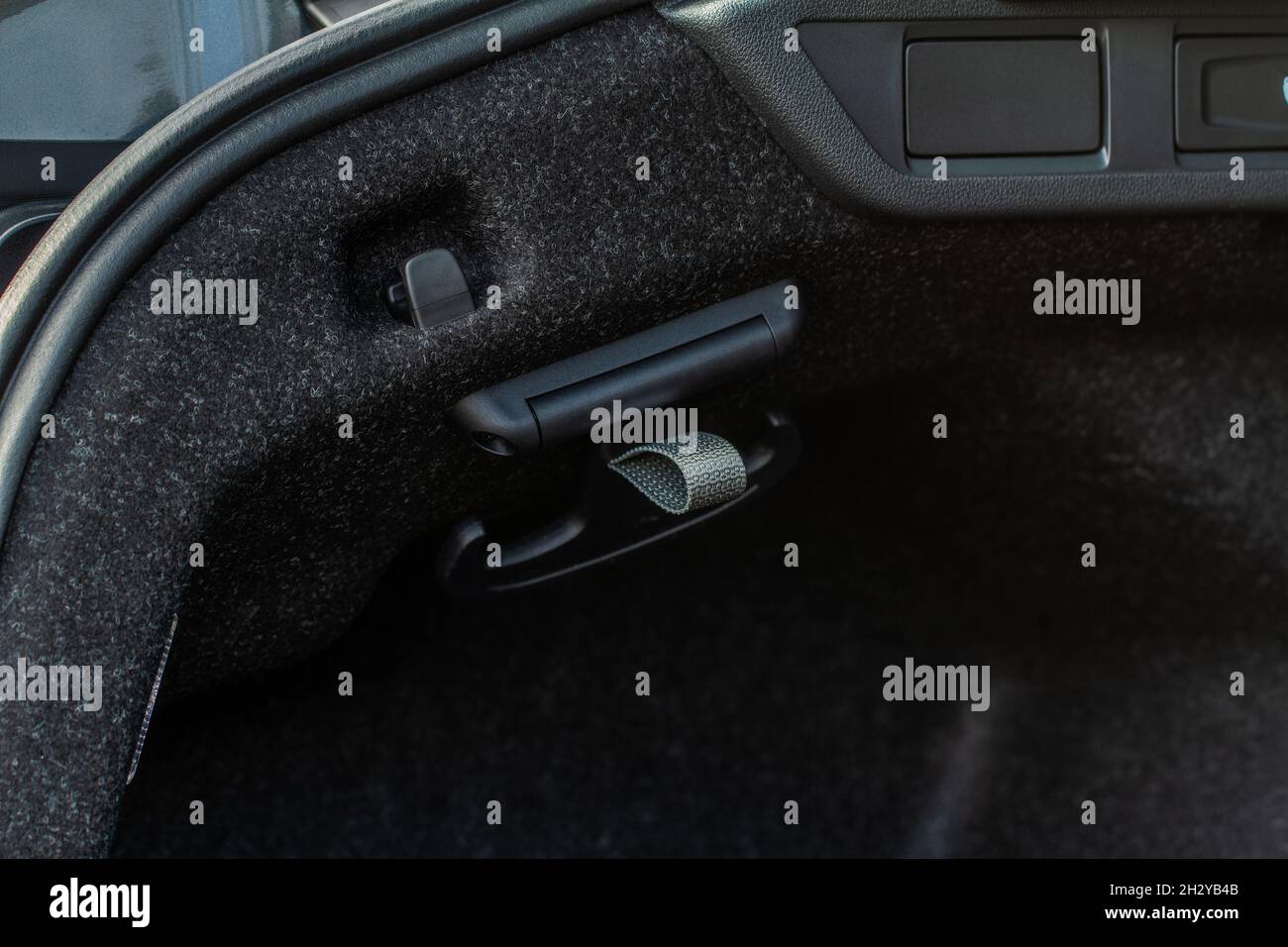 A hook for packages in the trunk of the car. Modern car trunk Stock ...