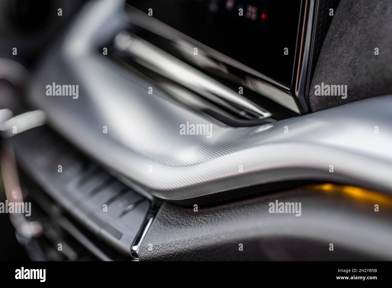 Modern car interior close up view with metallic and plastic details ...