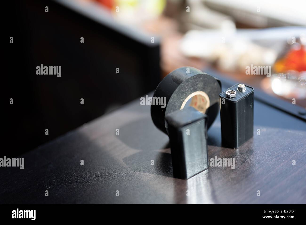 9 volt dead battery with terminals covered with electrical tape for ...