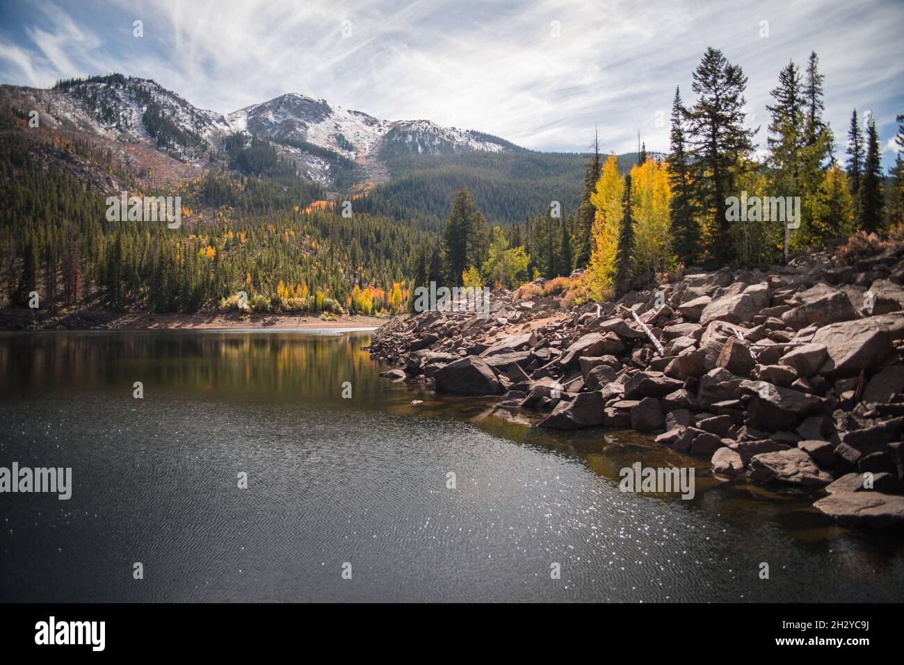A lake surrounded by fall foliage at Independence Pass near Aspen ...