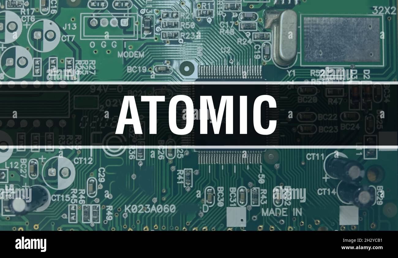 Atomic concept with Computer motherboard. Atomic text written on ...