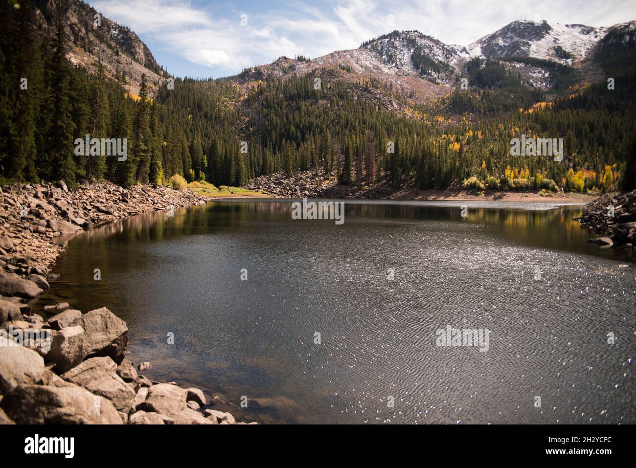 A lake surrounded by fall foliage at Independence Pass near Aspen ...