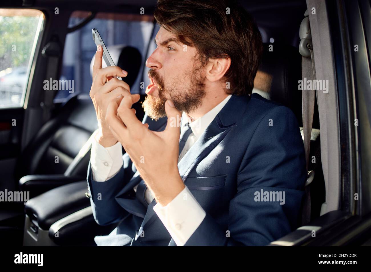 bearded man official passenger driver road success Stock Photo - Alamy