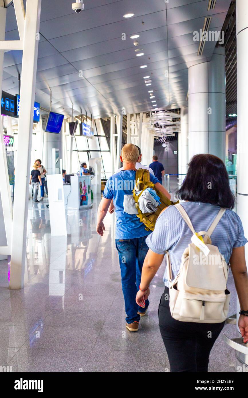 people go to check-in at the international airport Stock Photo - Alamy