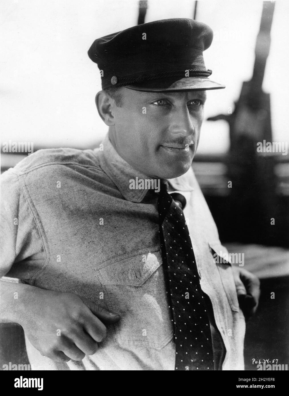 Director IRVIN V. WILLAT on set location candid on sailing ship during ...