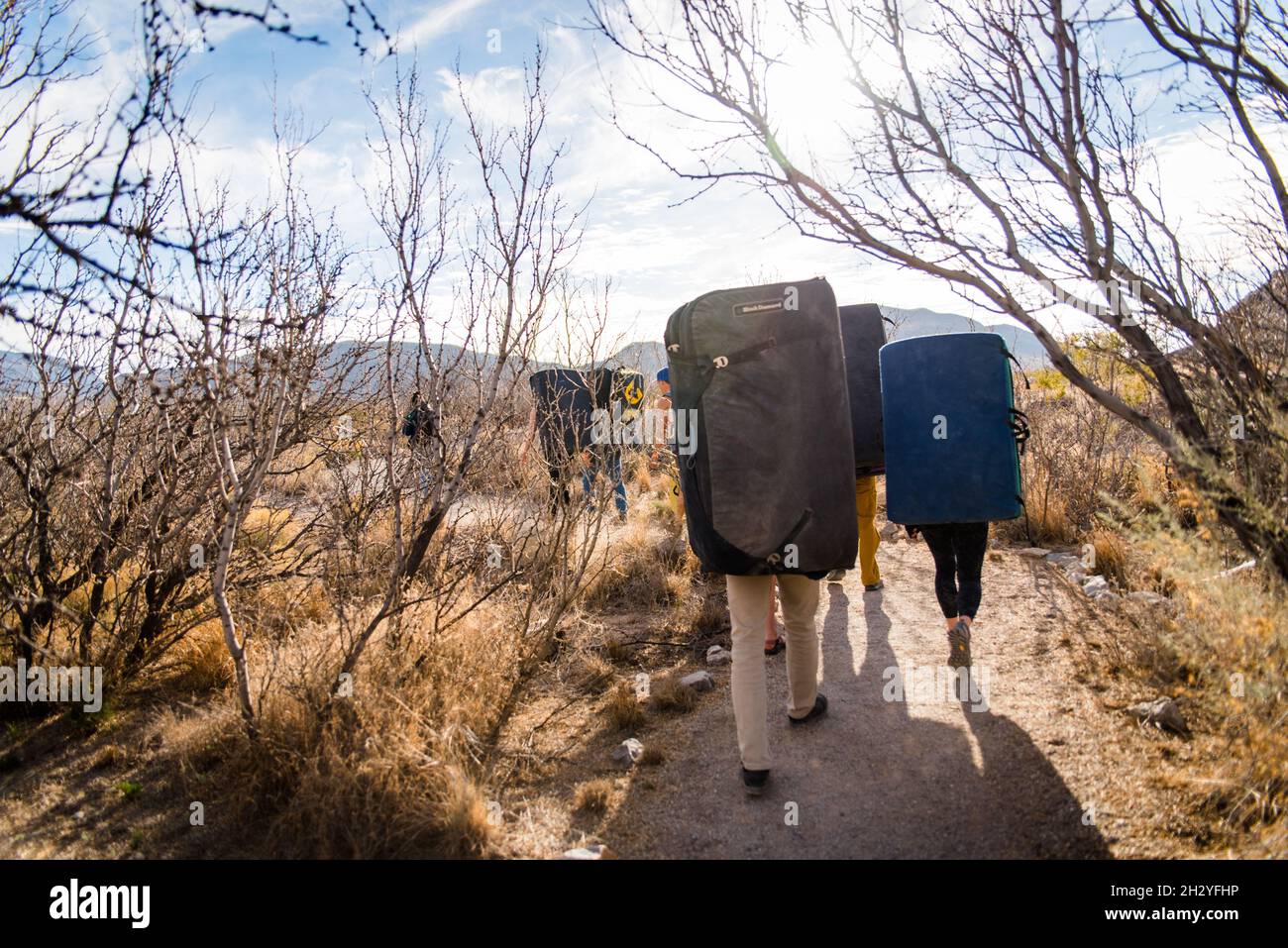 Rock Climbers walking on a path at Hueco Tanks State Park in El Paso ...