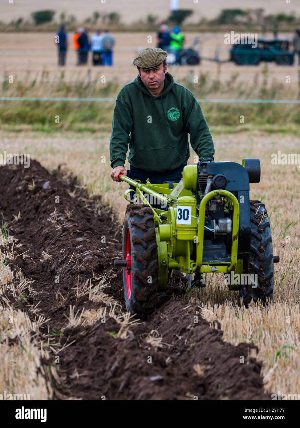Man with hand plough ploughing furrow at 70th British Ploughing ...