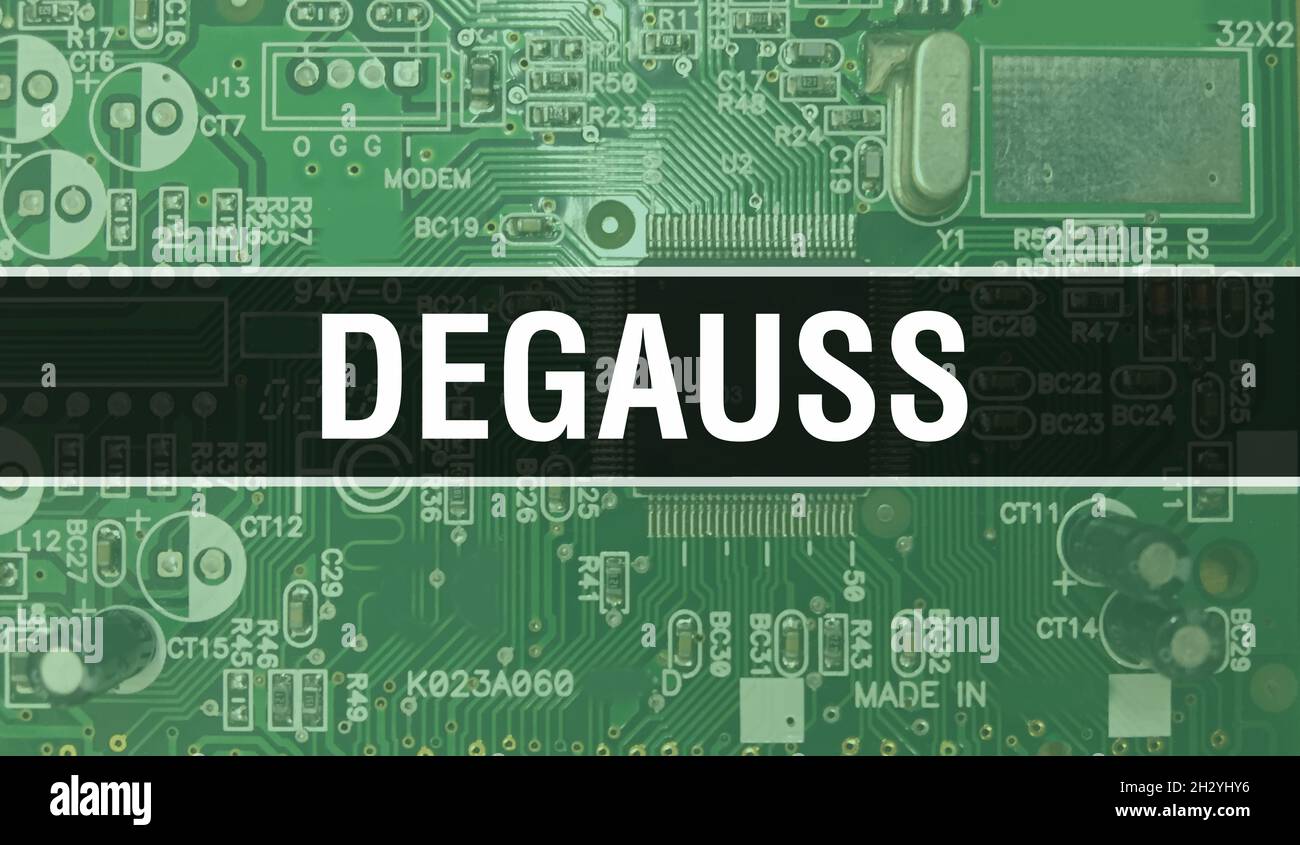 Degauss concept with Computer motherboard. Degauss text written on ...