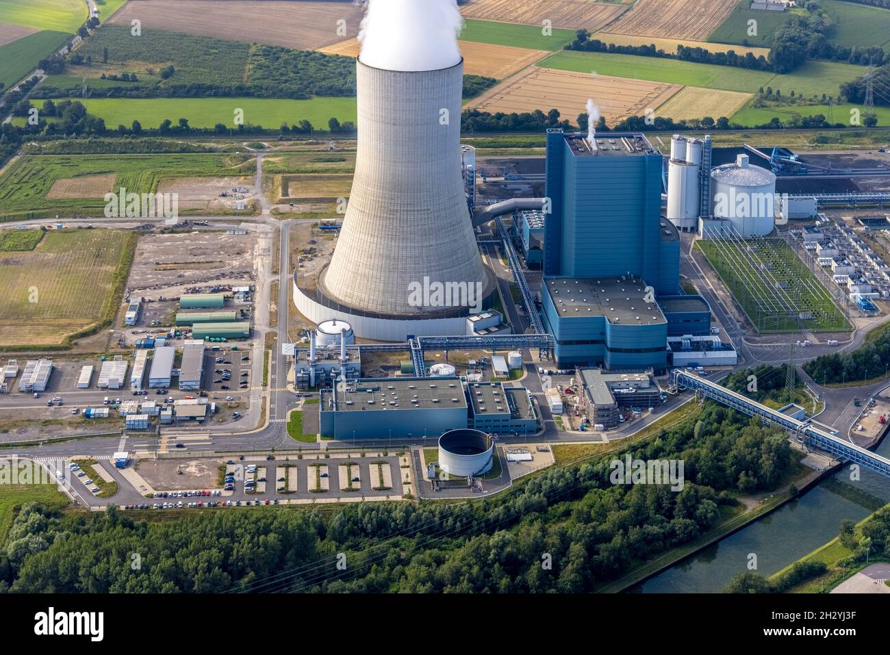 Aerial view of the power plant facilities and exhaust towers of the ...