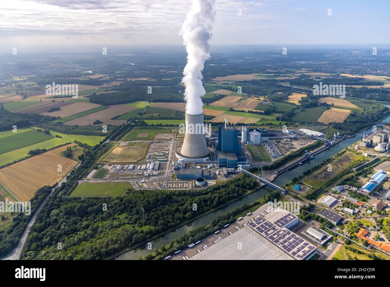 Aerial view of the power plant facilities and exhaust towers of the ...