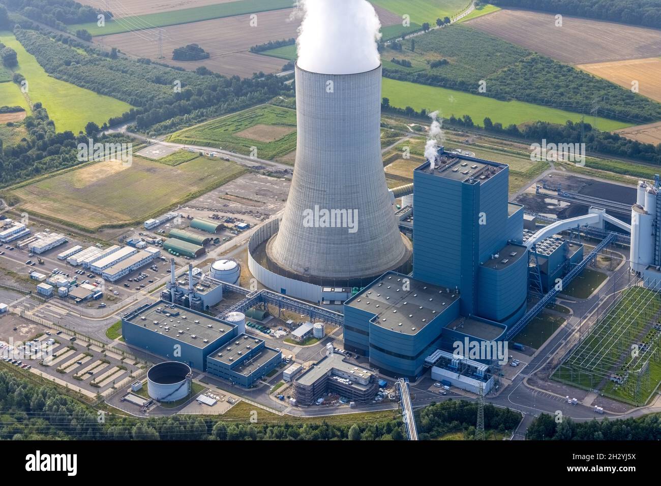 Aerial view of the power plant facilities and exhaust towers of the ...