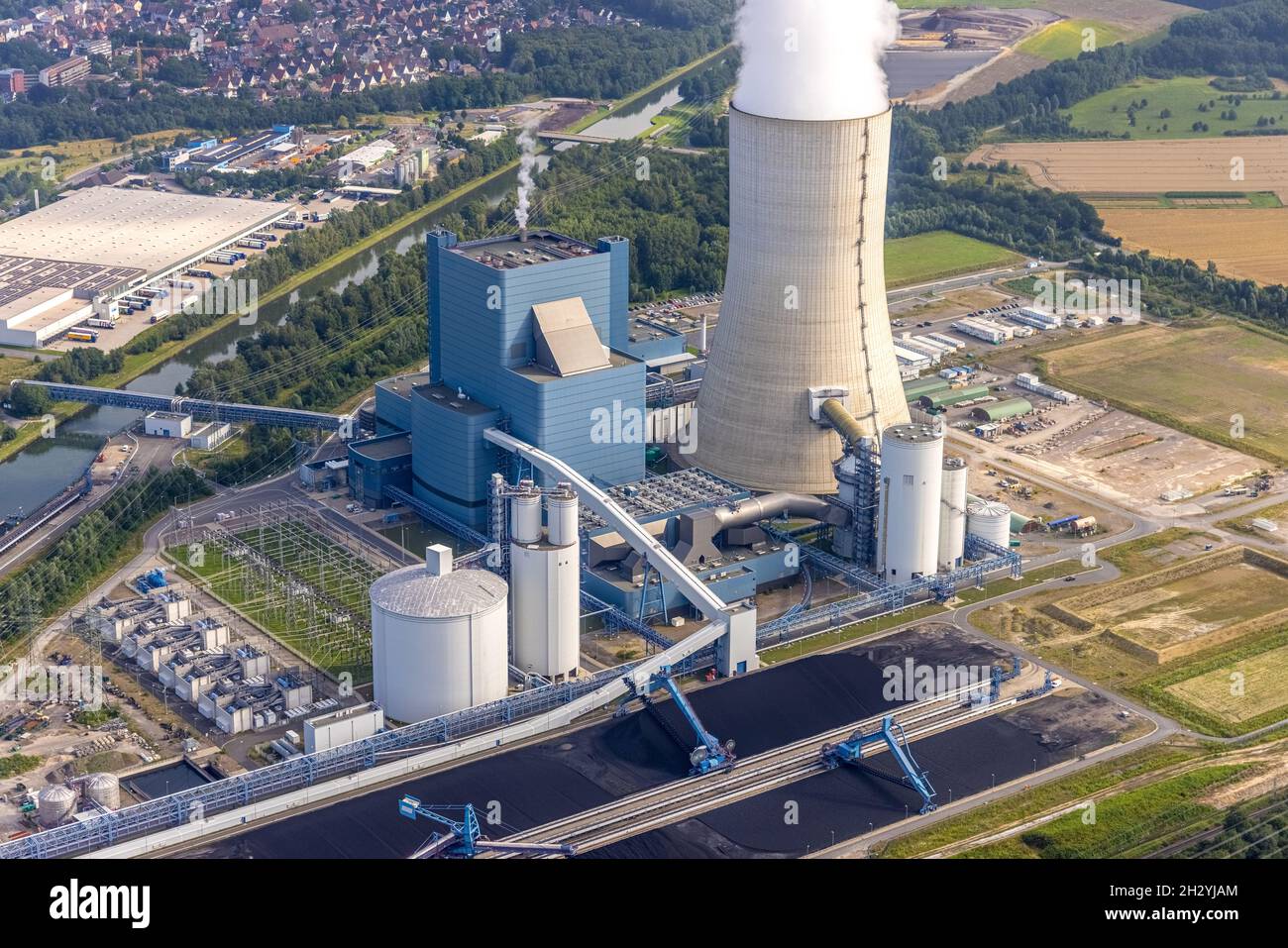 Aerial view of the power plant facilities and exhaust towers of the ...
