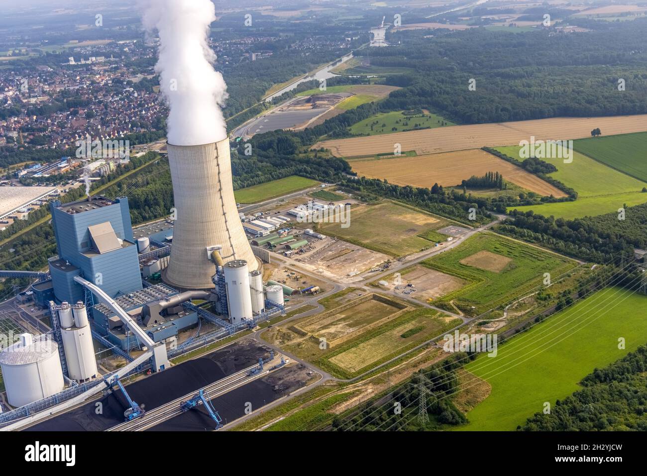 Aerial view of the power plant facilities and exhaust towers of the ...