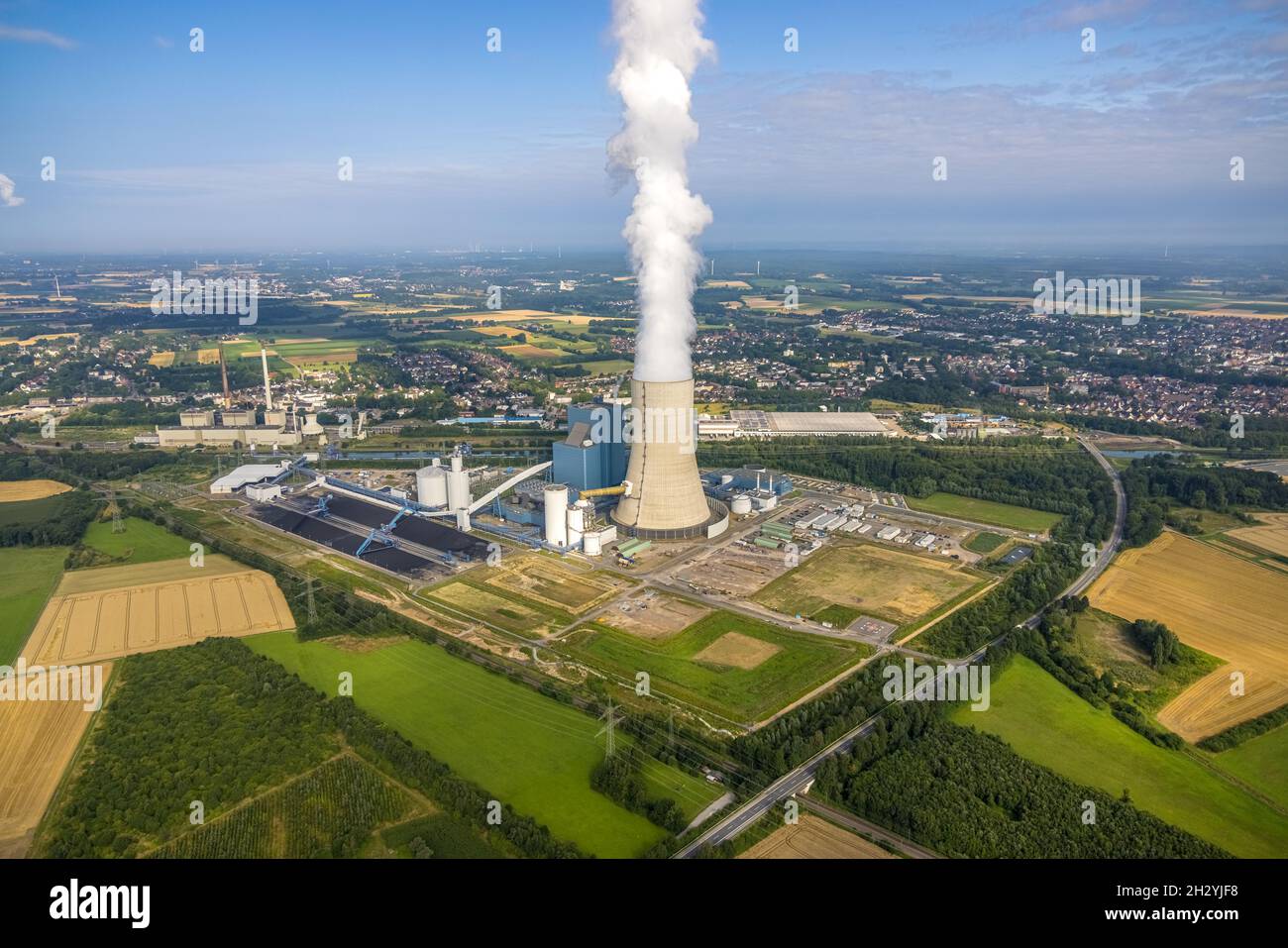 Aerial view of the power plant facilities and exhaust towers of the ...
