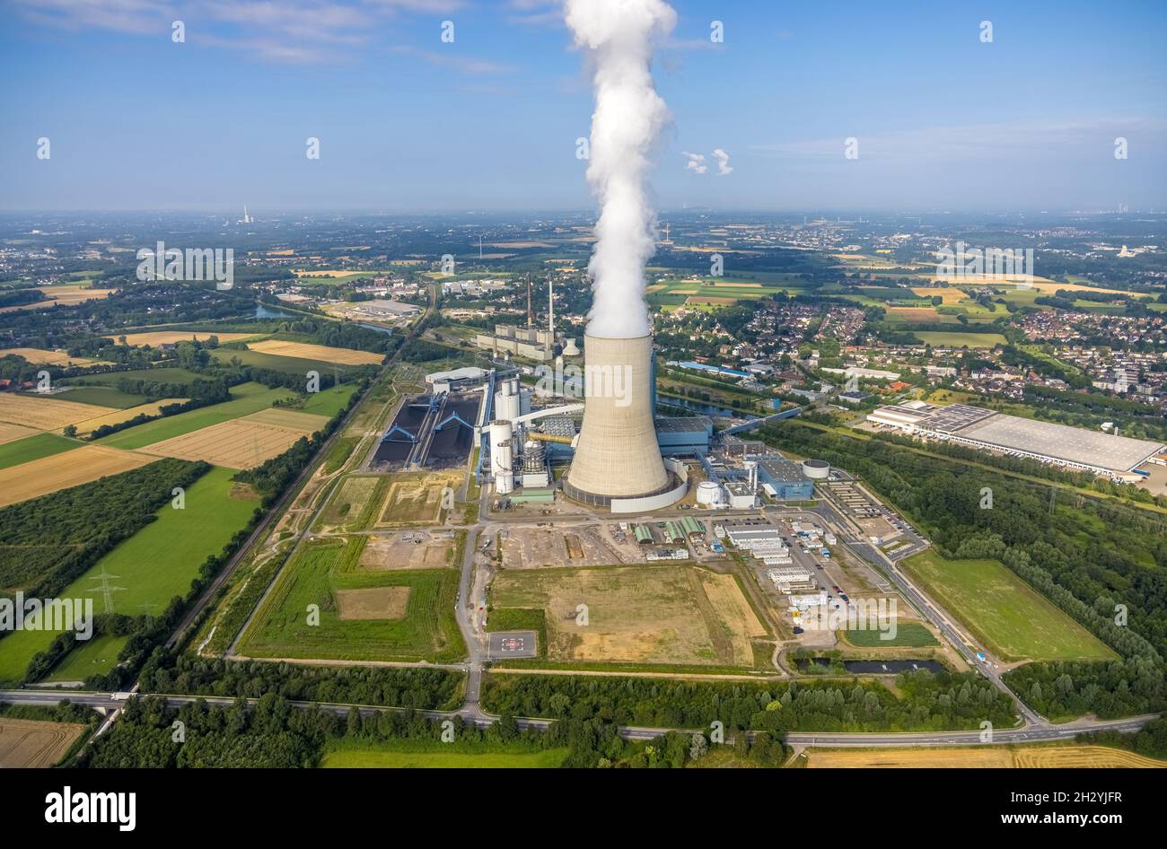 Aerial view of the power plant facilities and exhaust towers of the ...