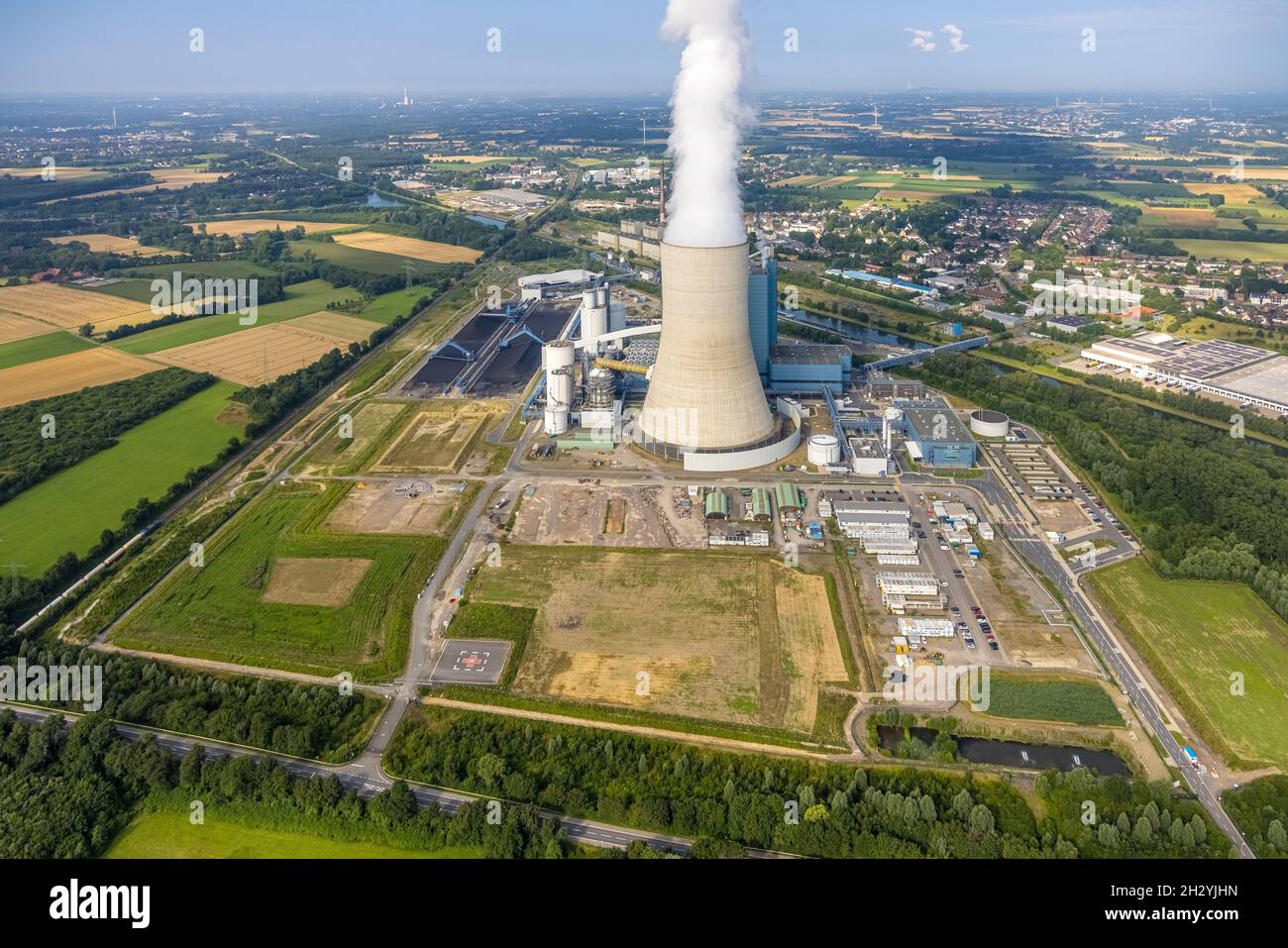 Aerial view of the power plant facilities and exhaust towers of the ...