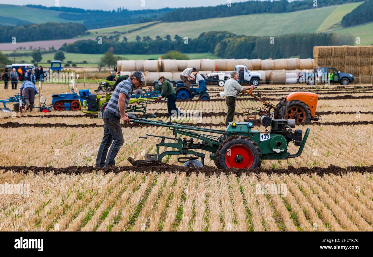Men creating furrows with hand ploughs ploughing furrows at 70th ...
